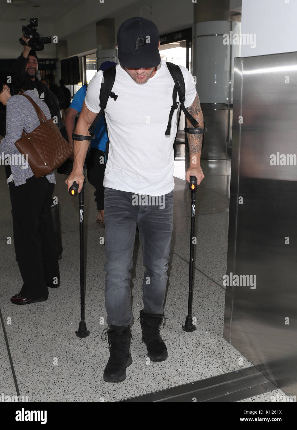 Ryan Phillippe arrives at Los Angeles International (LAX) on crutches ...
