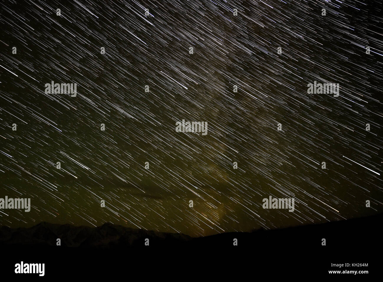 Beautiful night view of the starry sky with traces of falling stars in ...