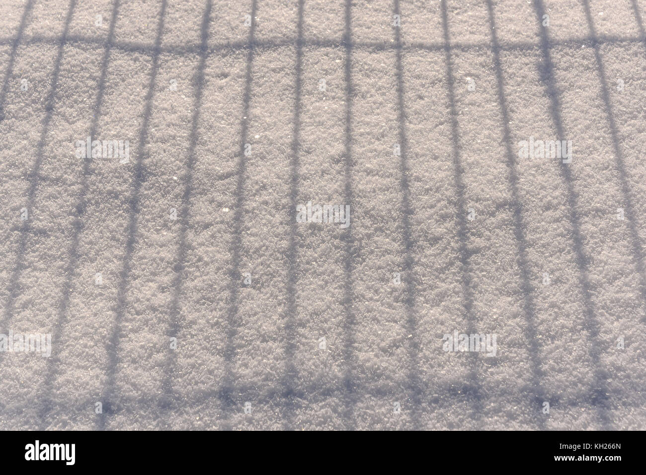 Winter abstract background with white snow surface with snow crystals ...
