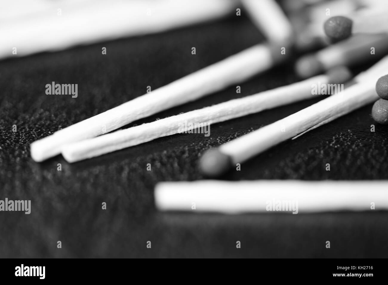 Scattered matches on dark background close up. Black and white Stock ...