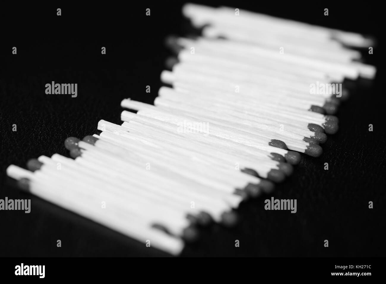 Scattered matches on dark background close up. Black and white Stock ...