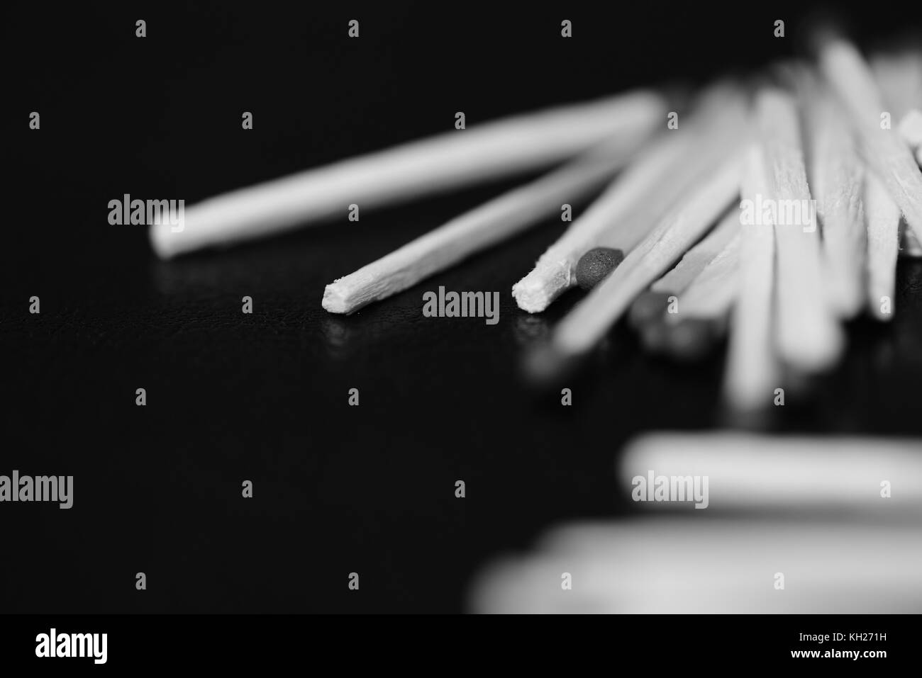 Scattered matches on dark background close up. Black and white Stock ...