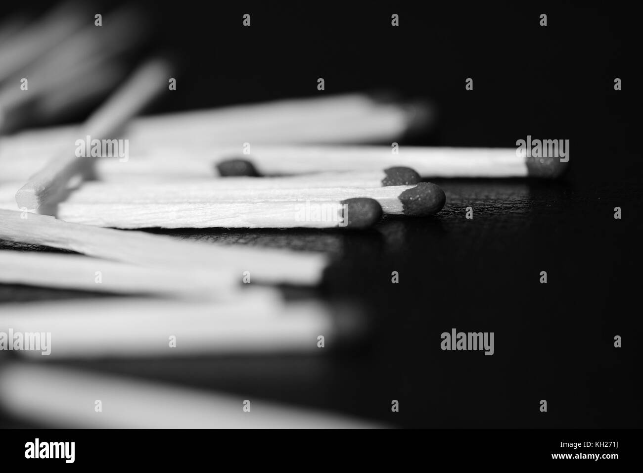 Scattered matches on dark background close up. Black and white Stock ...