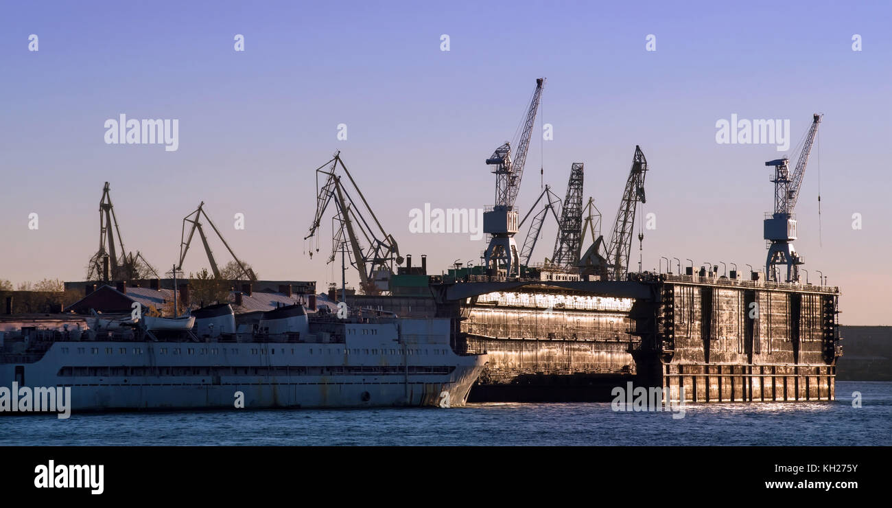 Dry dock and harbor cranes panorama. Industrial landscape Stock Photo ...