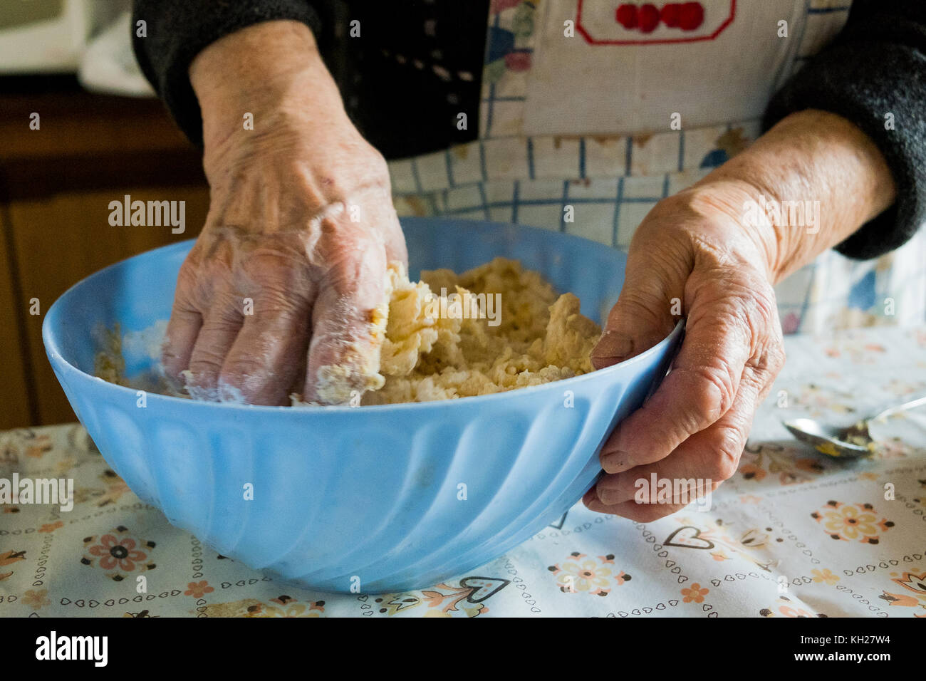 grandma making pasta the old traditional way in her home Stock Photo ...