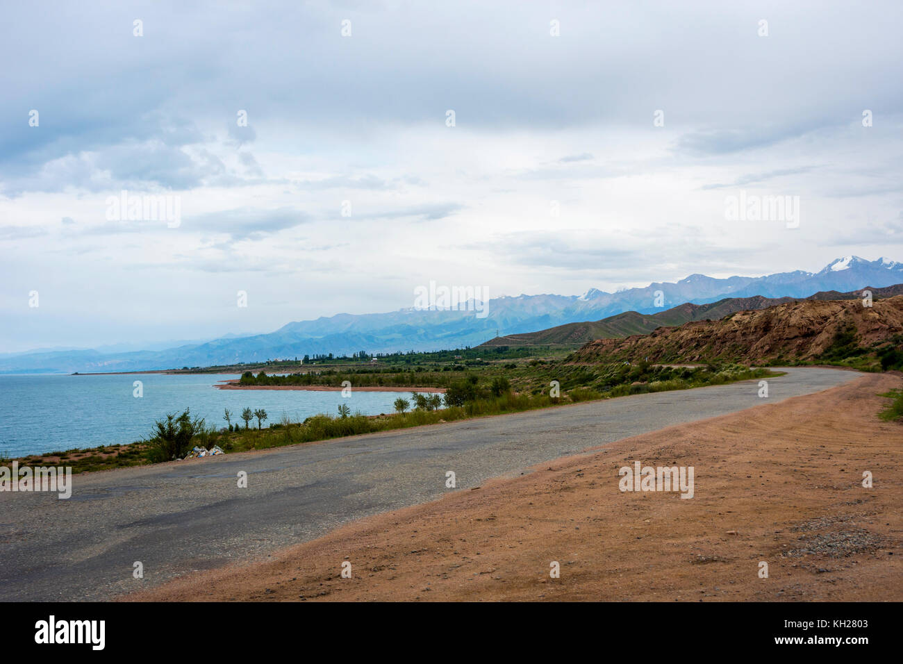 Road passing Karakol lake and Skazka Canyon, Kyrgyzstan Stock Photo - Alamy