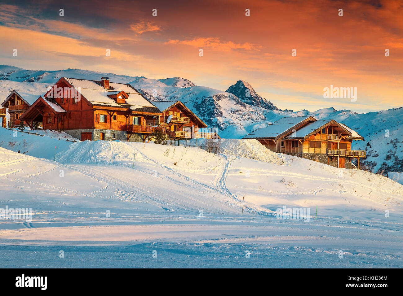 Amazing winter sunset landscape and ski resort with spectacular wooden ...