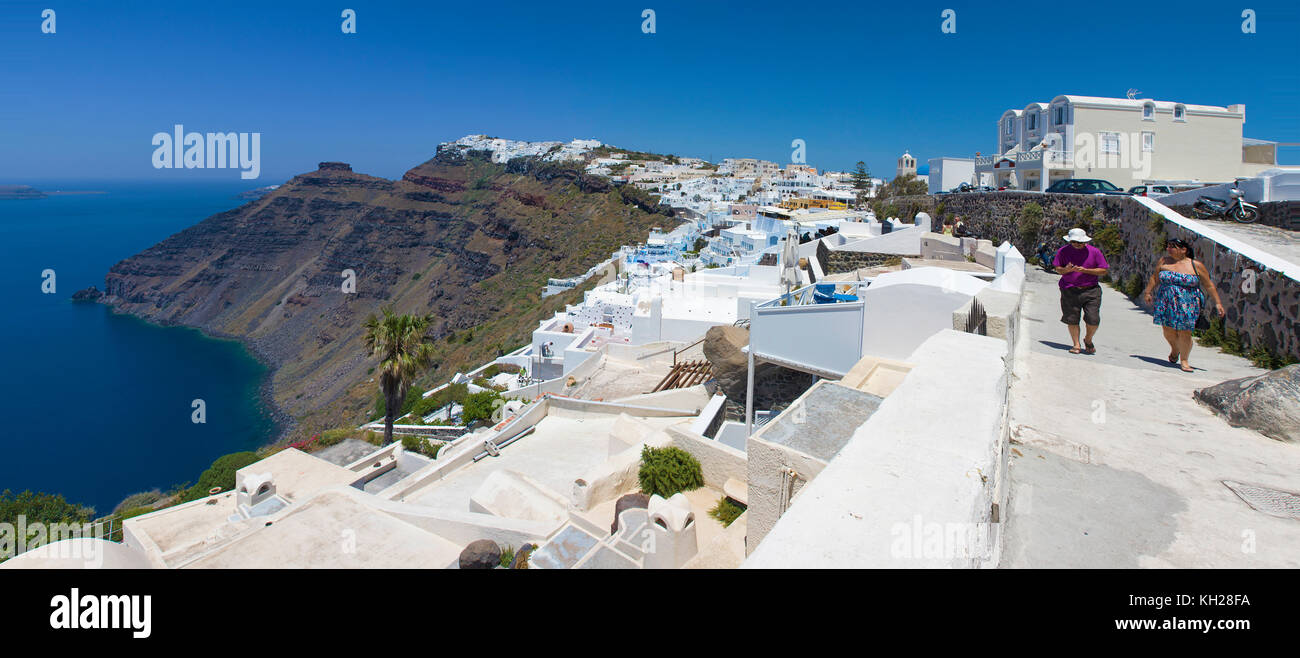 Crater edge path at Firofestani on Caldera and the village Imerovigli ...