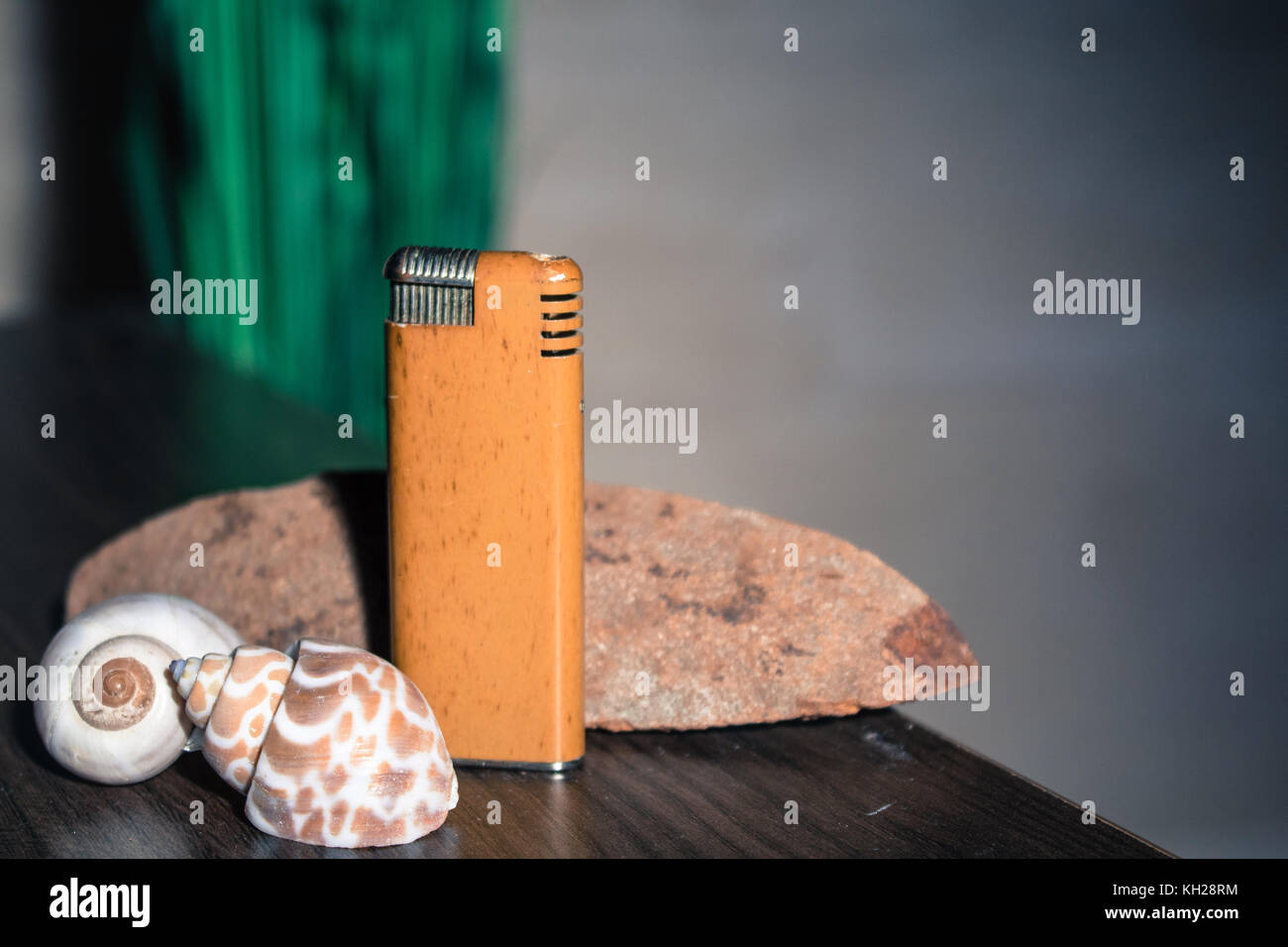 Lighter with sea shells Stock Photo - Alamy
