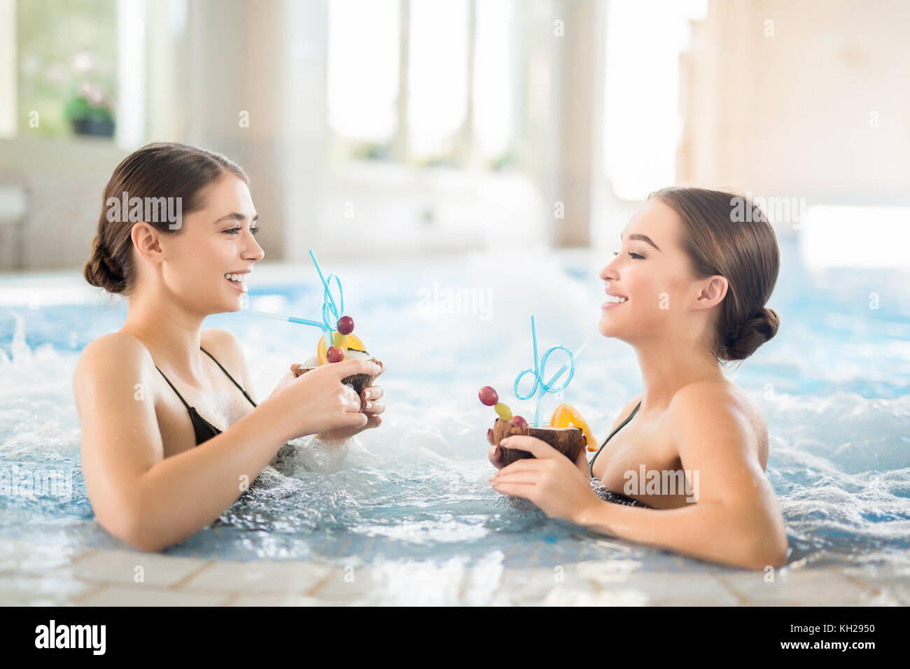 Friends laughing bikini water hi-res stock photography and images - Alamy