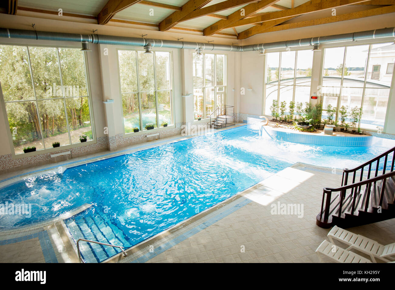 Spacious room with swimming-pool in its center at spa resort or hotel ...