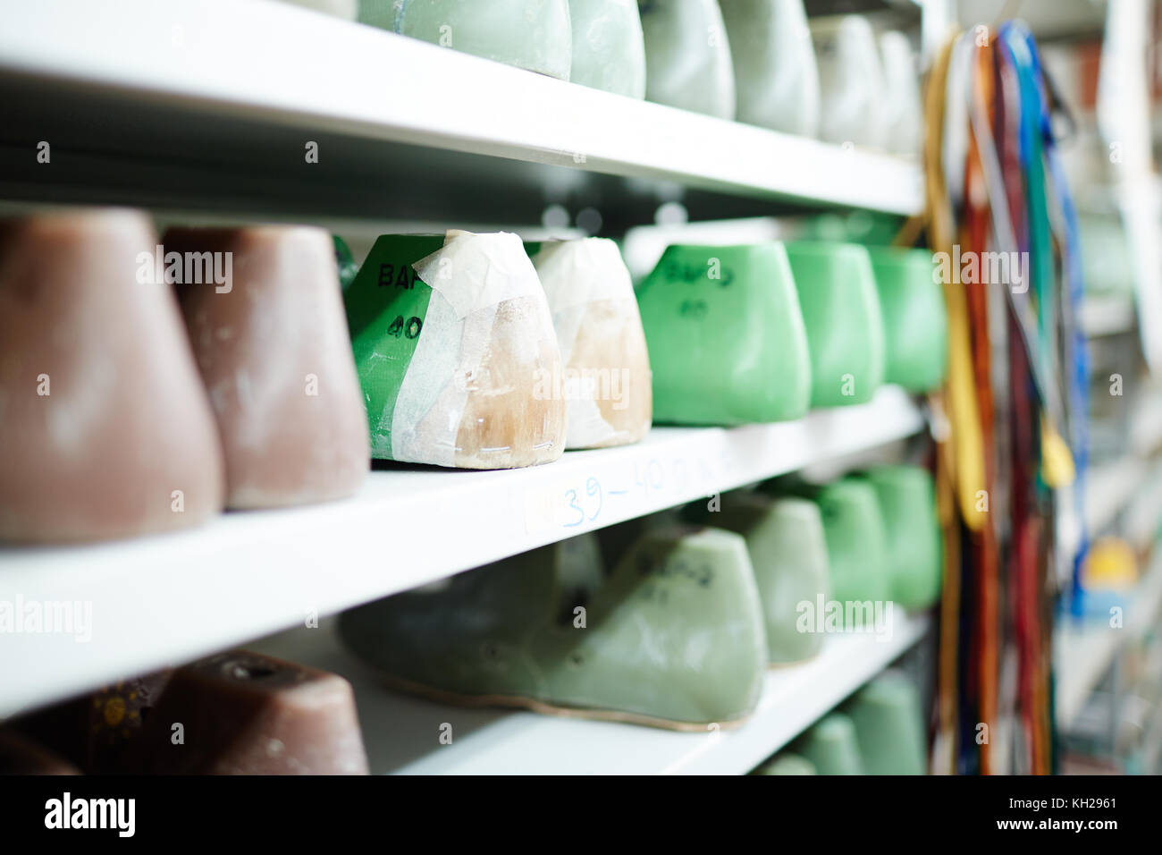 Shelves with shoe workpieces in workshop of cobbler Stock Photo - Alamy