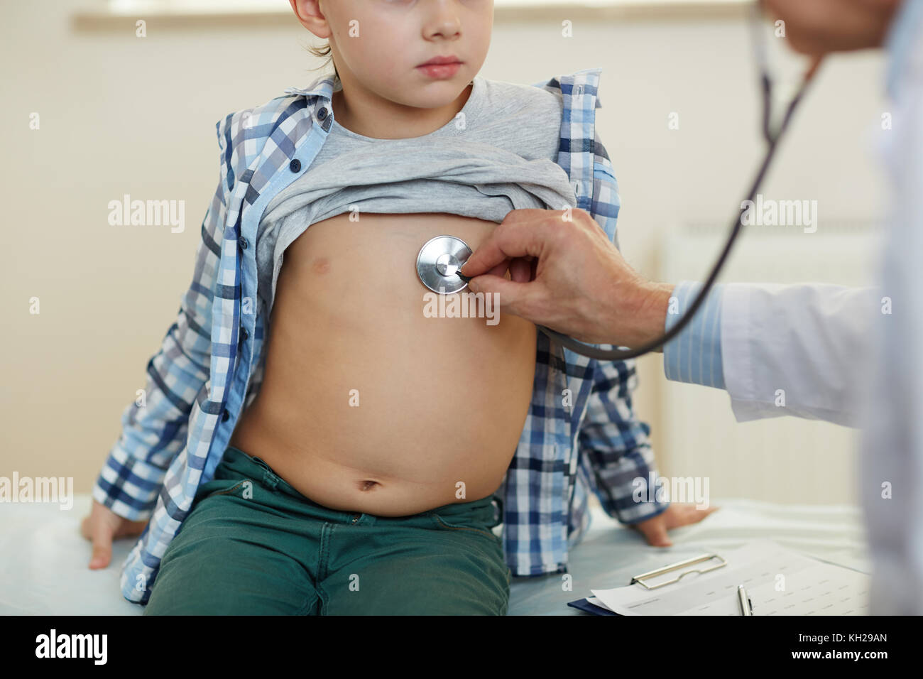 Check-up of little boy breath and heart-beat Stock Photo - Alamy