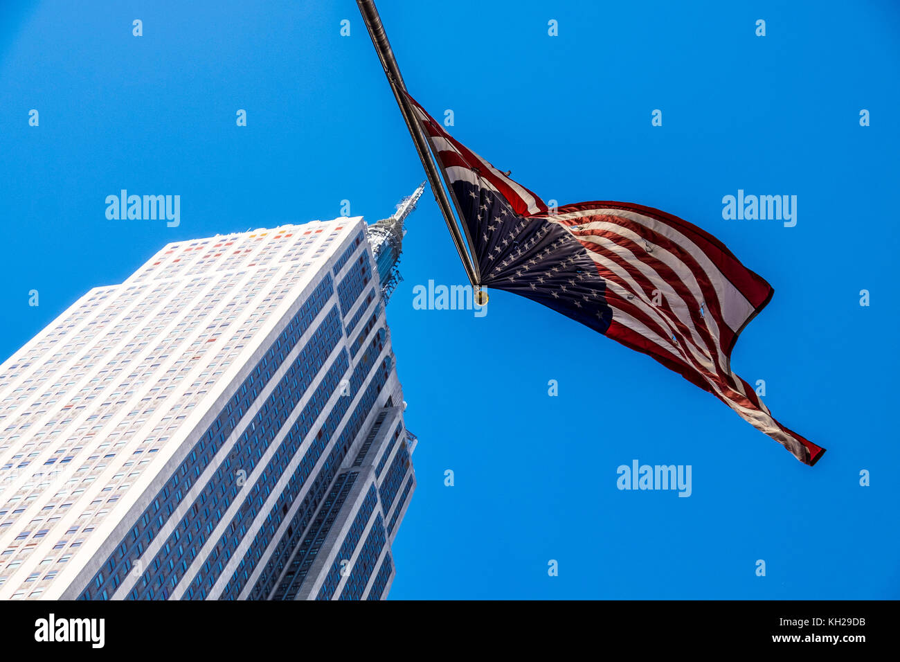 Empire State Building, New York with stars and stripes flying Stock ...