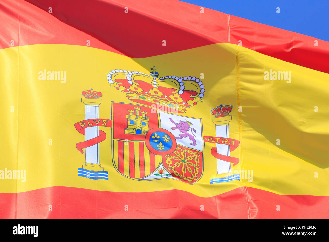 The official flag of Spain with coat of arms flying proudly over the ...