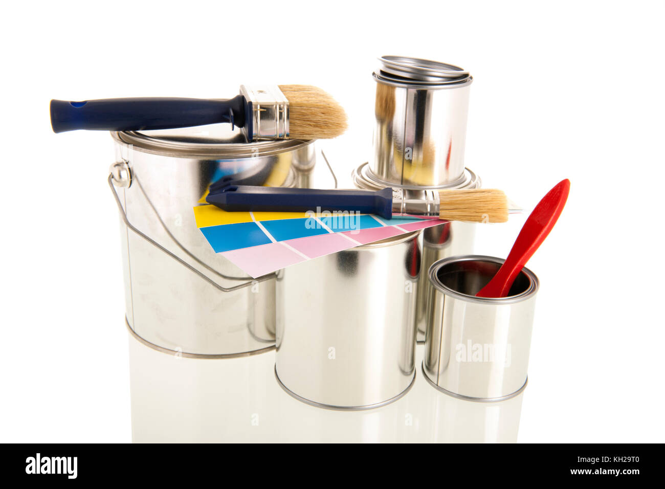 Metal tins for paint with blue brushes isolated over white background ...