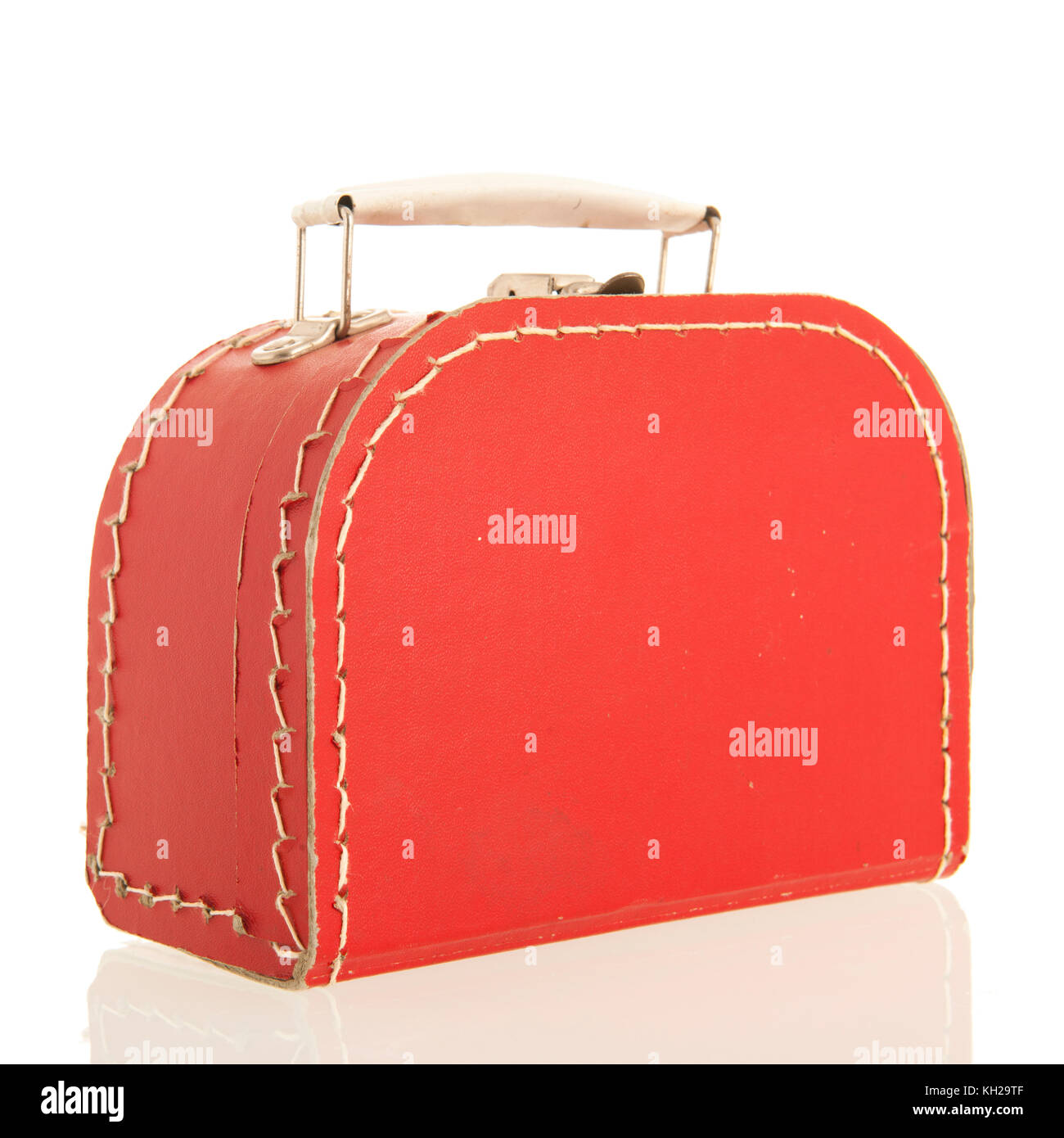 Little red toy suitcase isolated over white background Stock Photo - Alamy