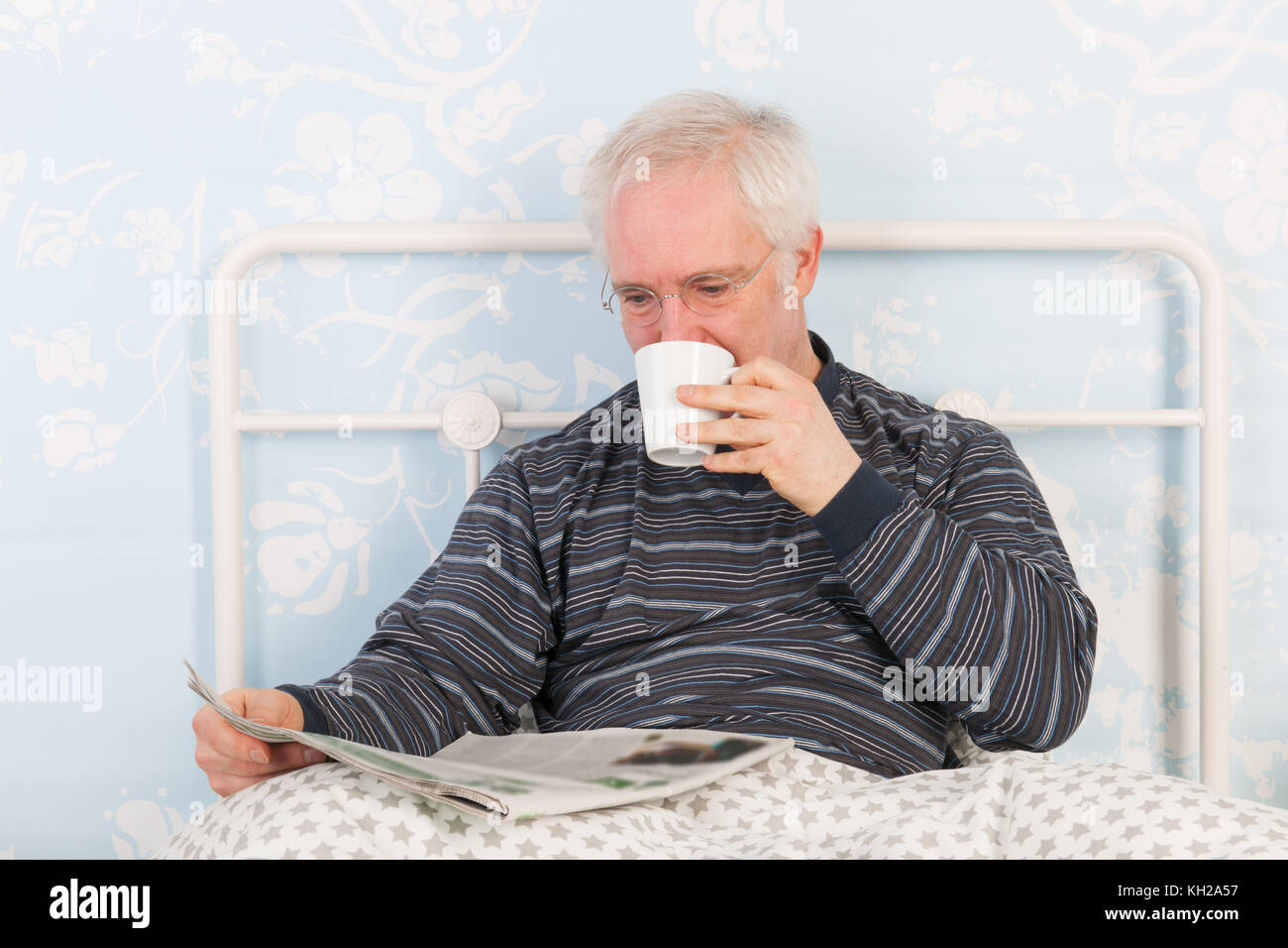 Man in bed Stock Photo - Alamy