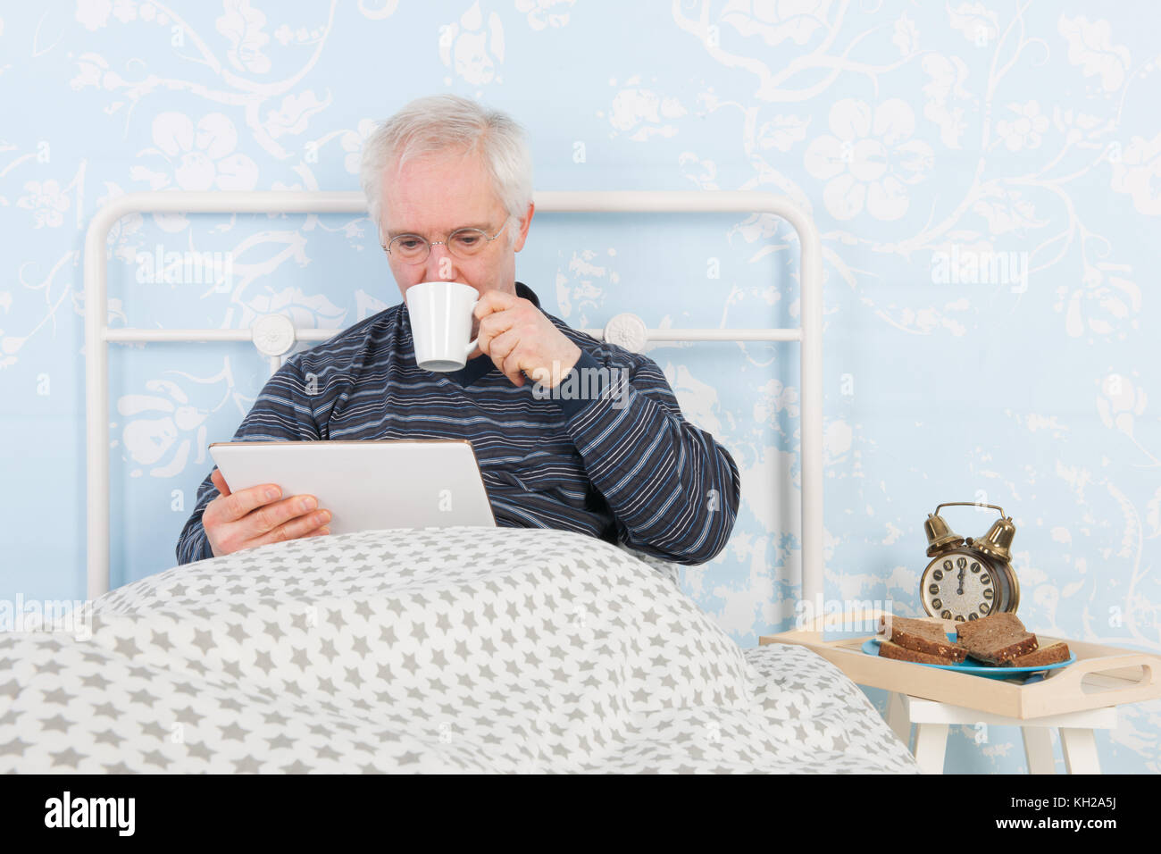 Man in bed Stock Photo - Alamy