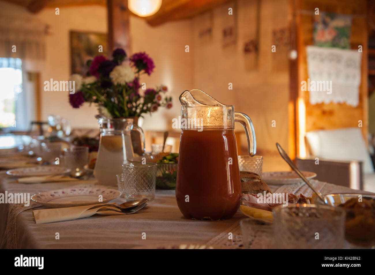 Decorated table with jug of juice Stock Photo - Alamy