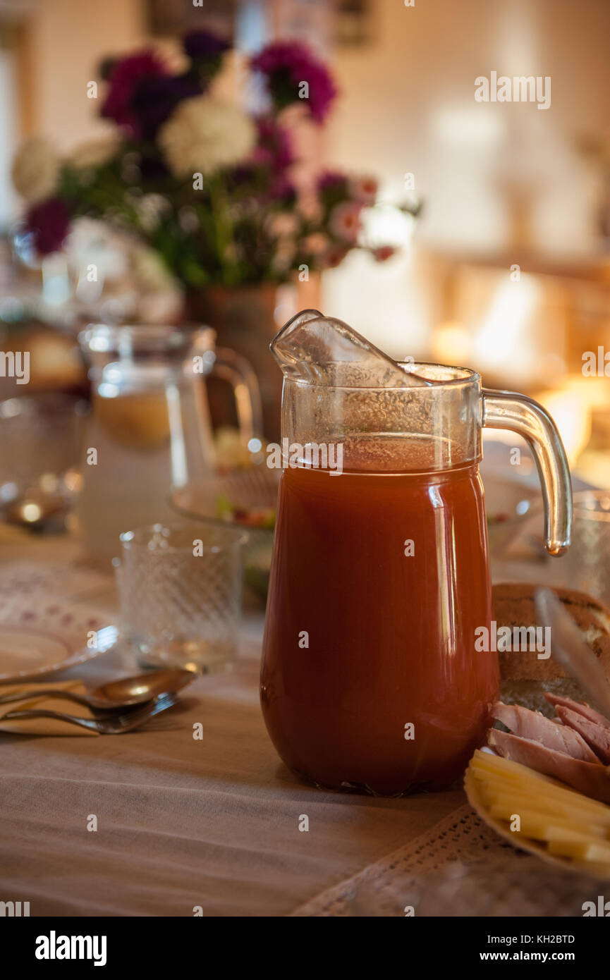 Decorated table with jug of juice Stock Photo - Alamy