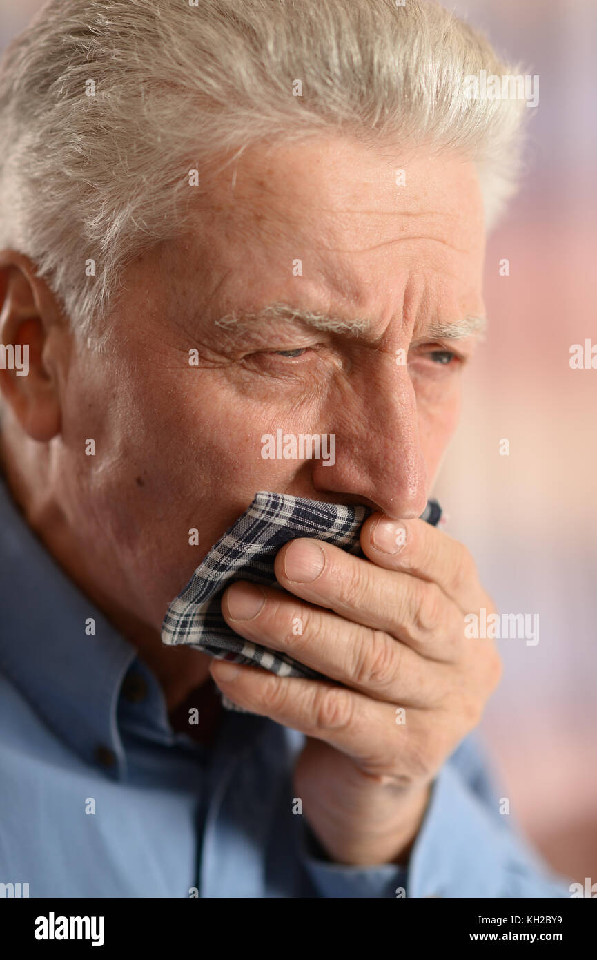 Senior man coughing Stock Photo - Alamy