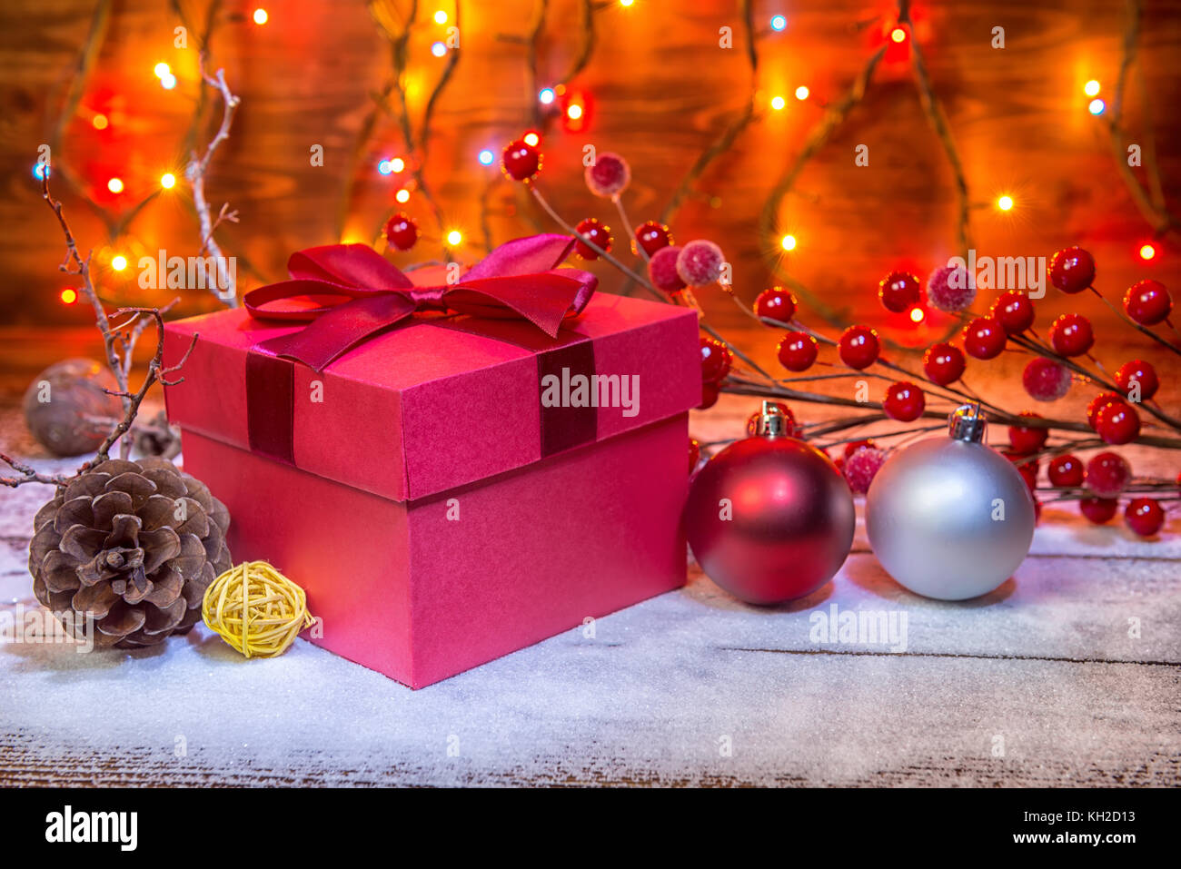 Christmas concept with red gift box, cone, balls, garland and festive ...