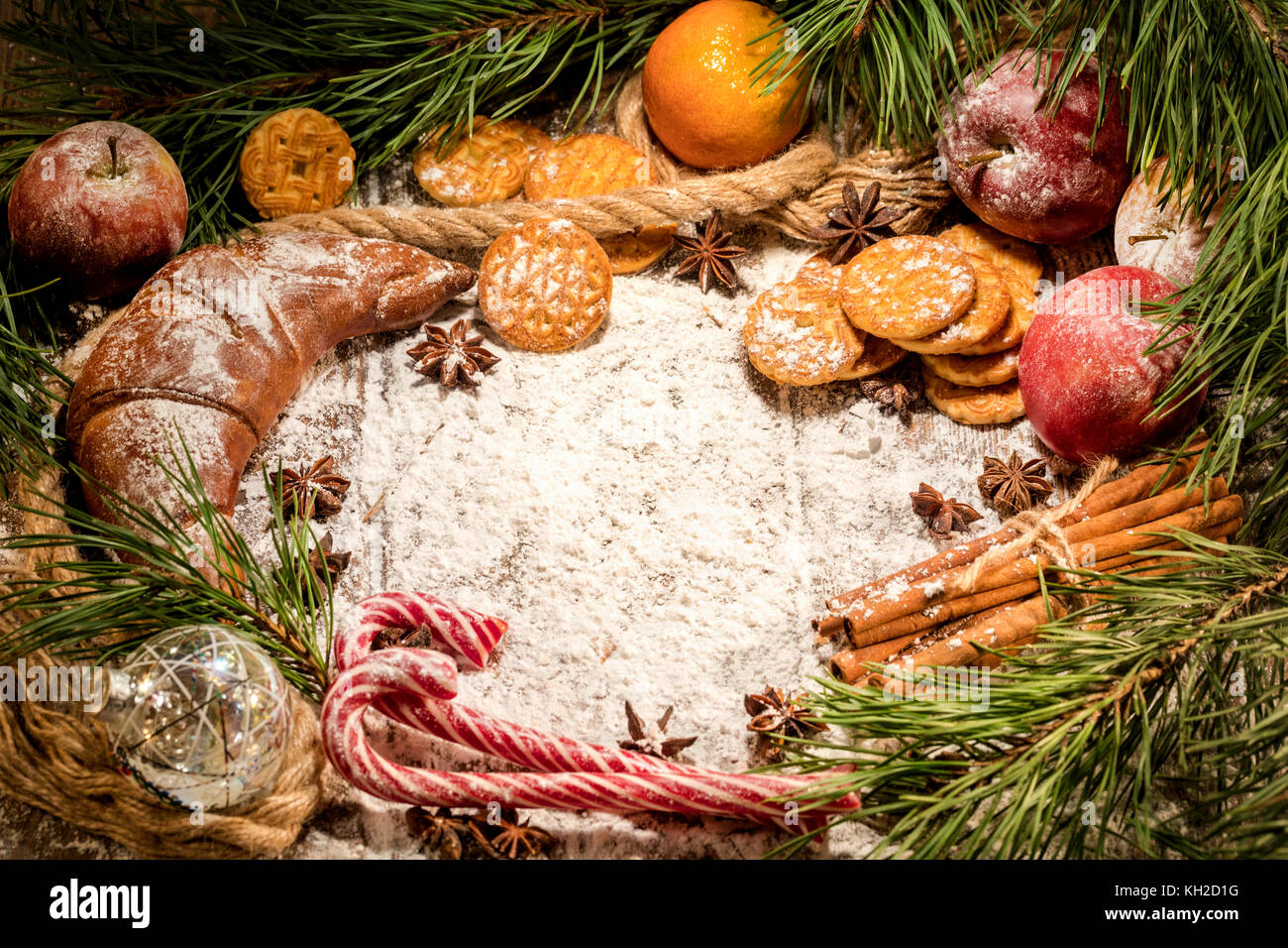Christmas still life with sweets and fruits under the Christmas tree ...