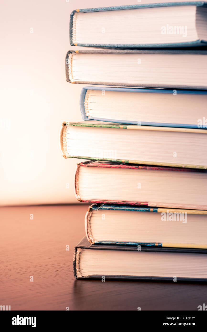 stack of old books on a table to the library Stock Photo - Alamy