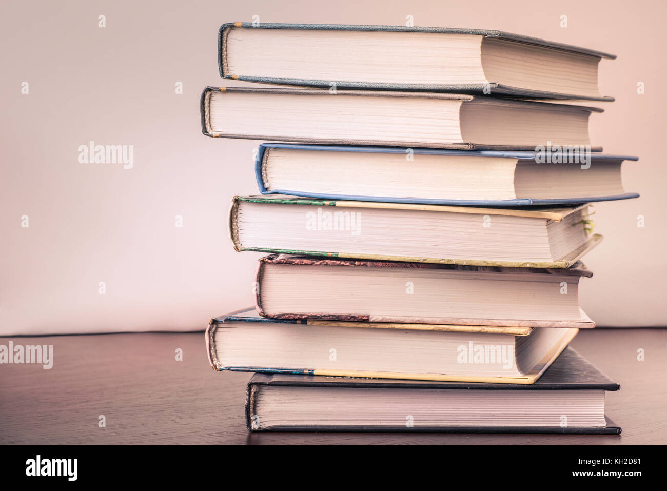 stack of old books on a table to the library Stock Photo - Alamy