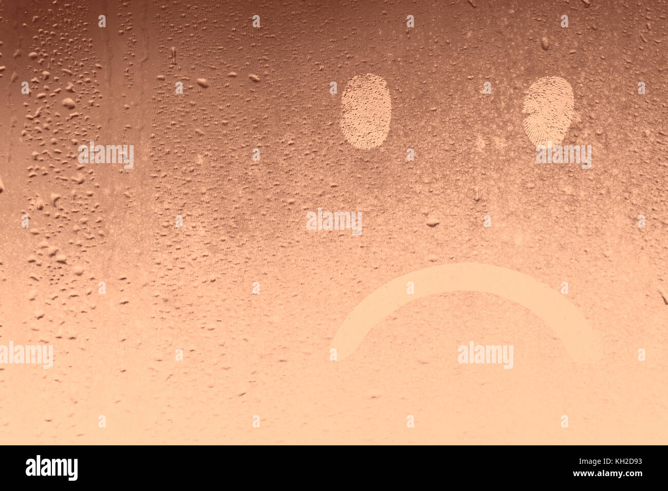 sad face on a wet window glass in the autumn Stock Photo - Alamy