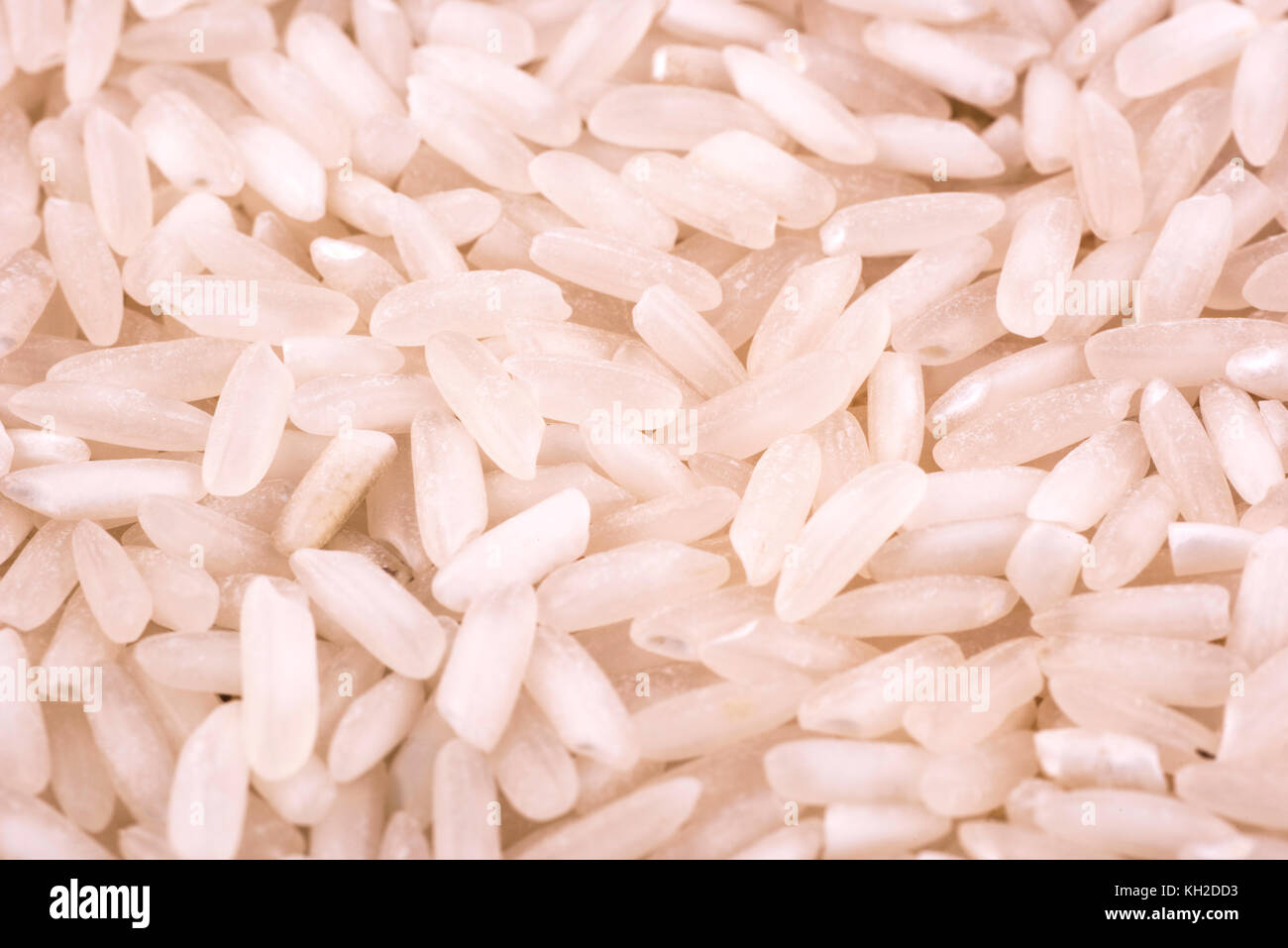 large white grains of rice close-up background Stock Photo - Alamy