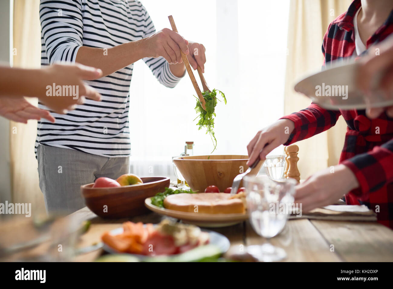 Side view mi-section of group of people standing at festive dinner ...