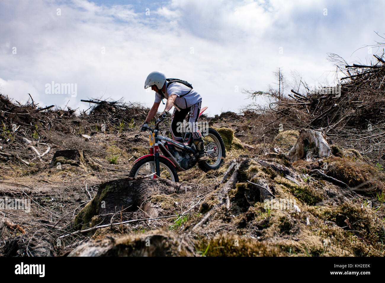Motorcross bike rider on a cross trail showing of skills on a difficult ...