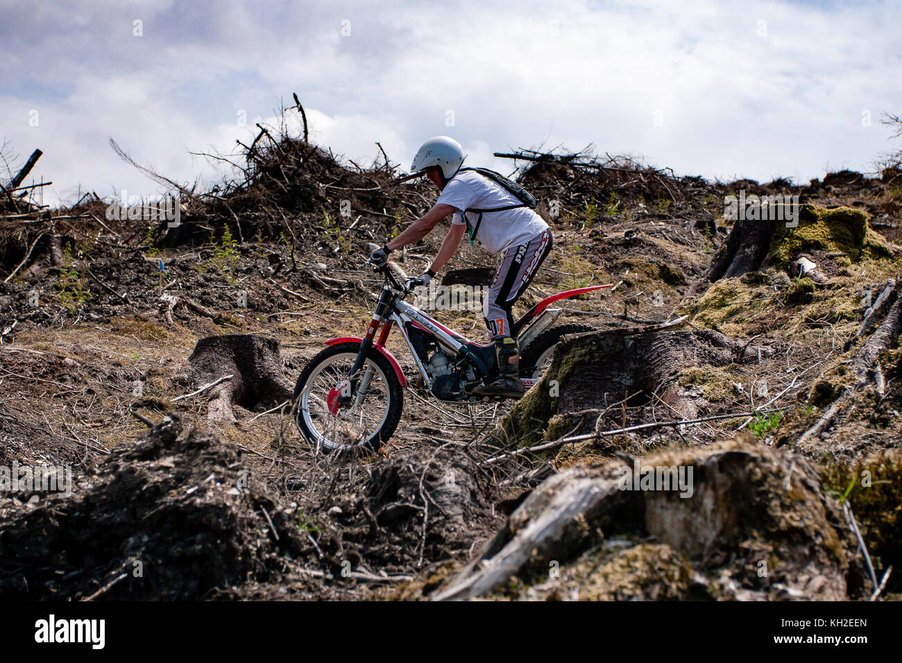 Motorcross bike rider on a cross trail showing of skills on a difficult ...