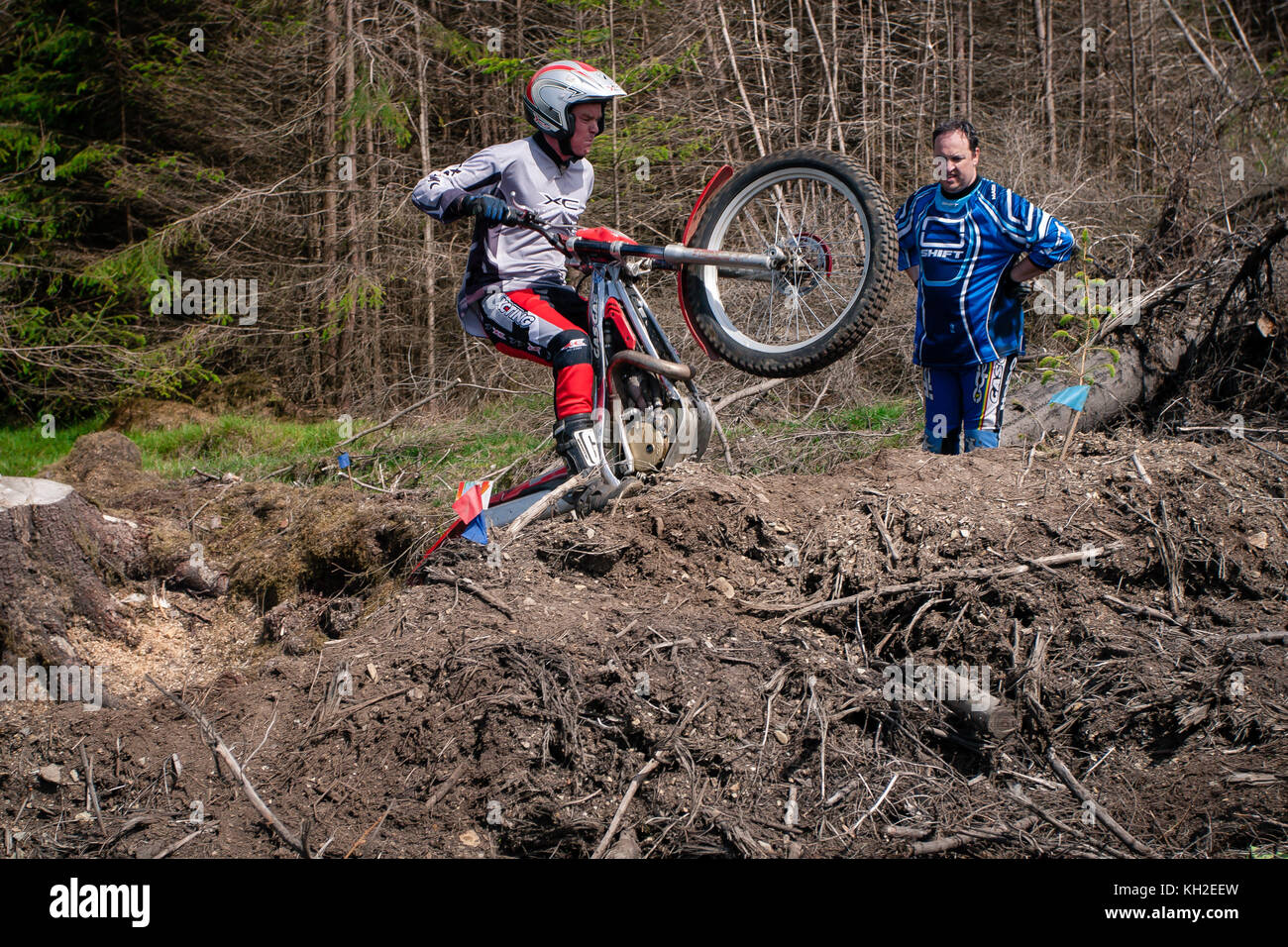 Motorcross bike rider on a cross trail showing of skills on a difficult ...