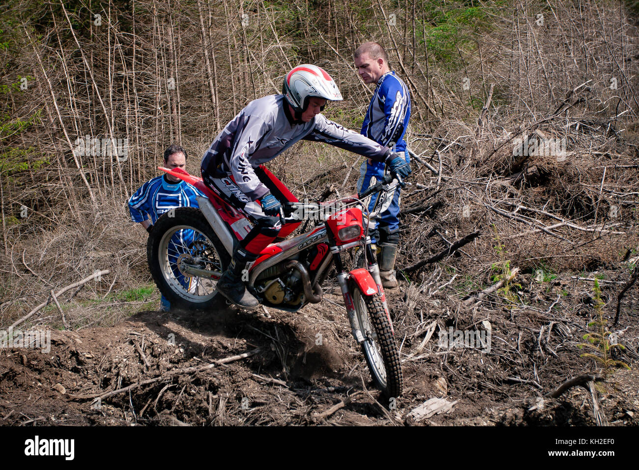 Motorcross bike rider on a cross trail showing of skills on a difficult ...
