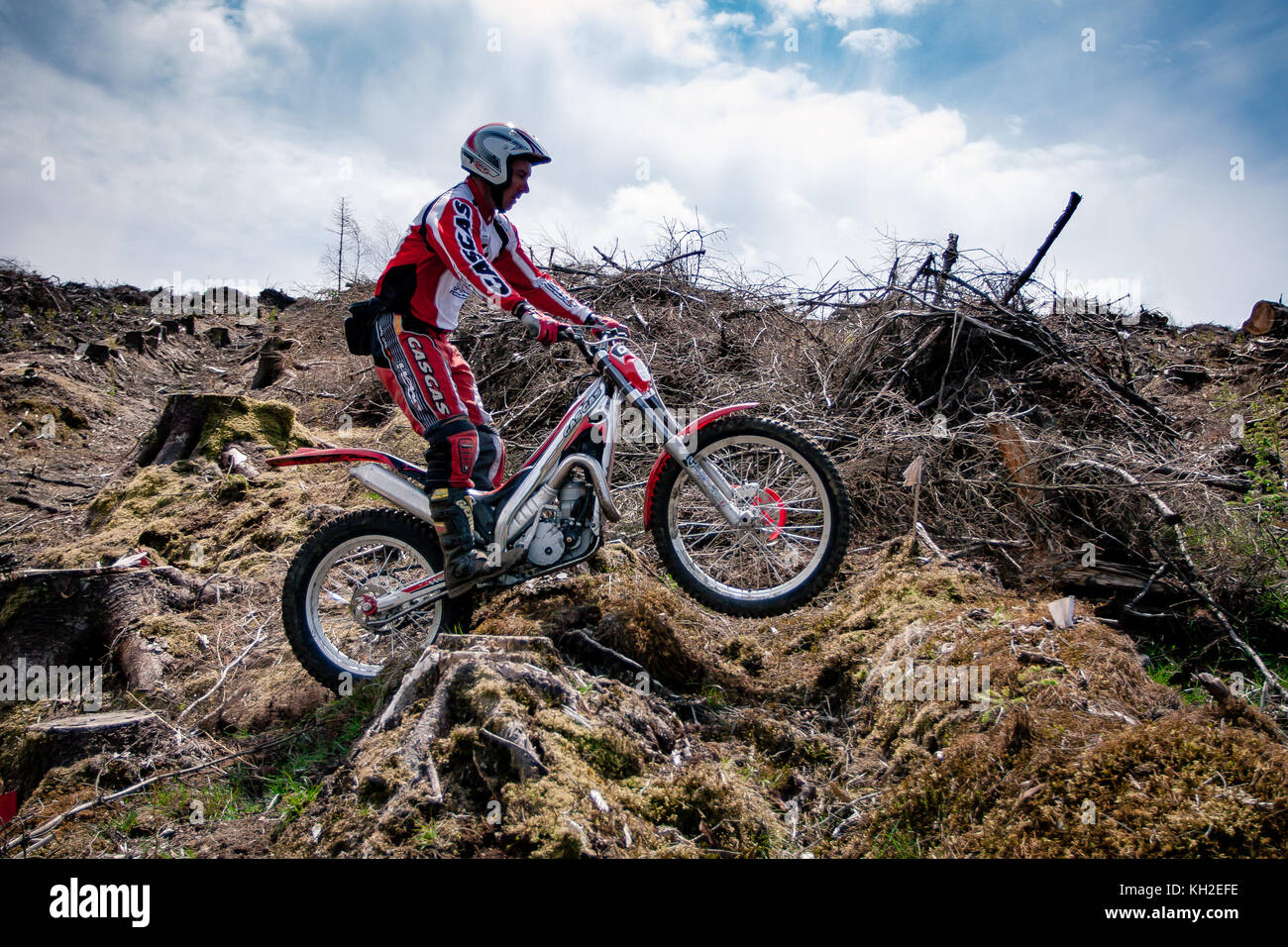 Motorcross bike rider on a cross trail showing of skills on a difficult ...