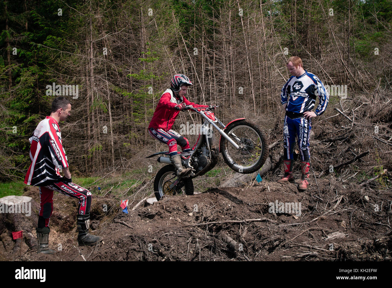 Motorcross bike rider on a cross trail showing of skills on a difficult ...