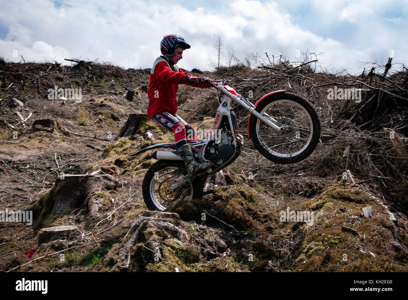 Motorcross bike rider on a cross trail showing of skills on a difficult ...
