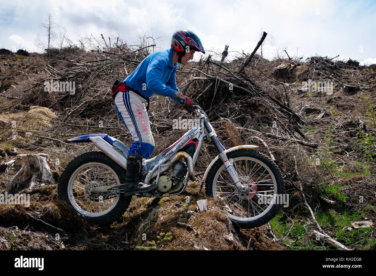 Motorcross bike rider on a cross trail showing of skills on a difficult ...