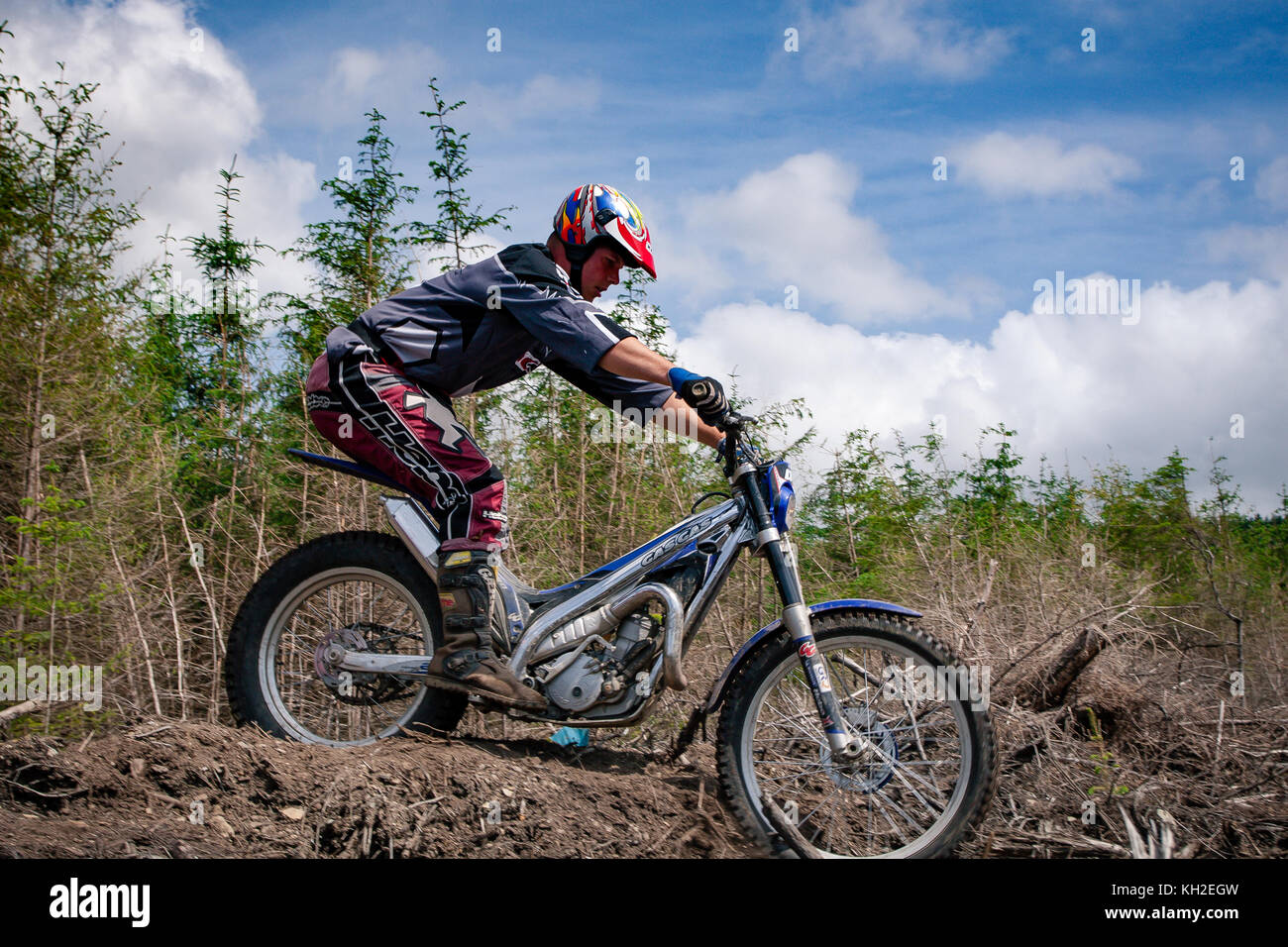 Motorcross bike rider on a cross trail showing of skills on a difficult ...