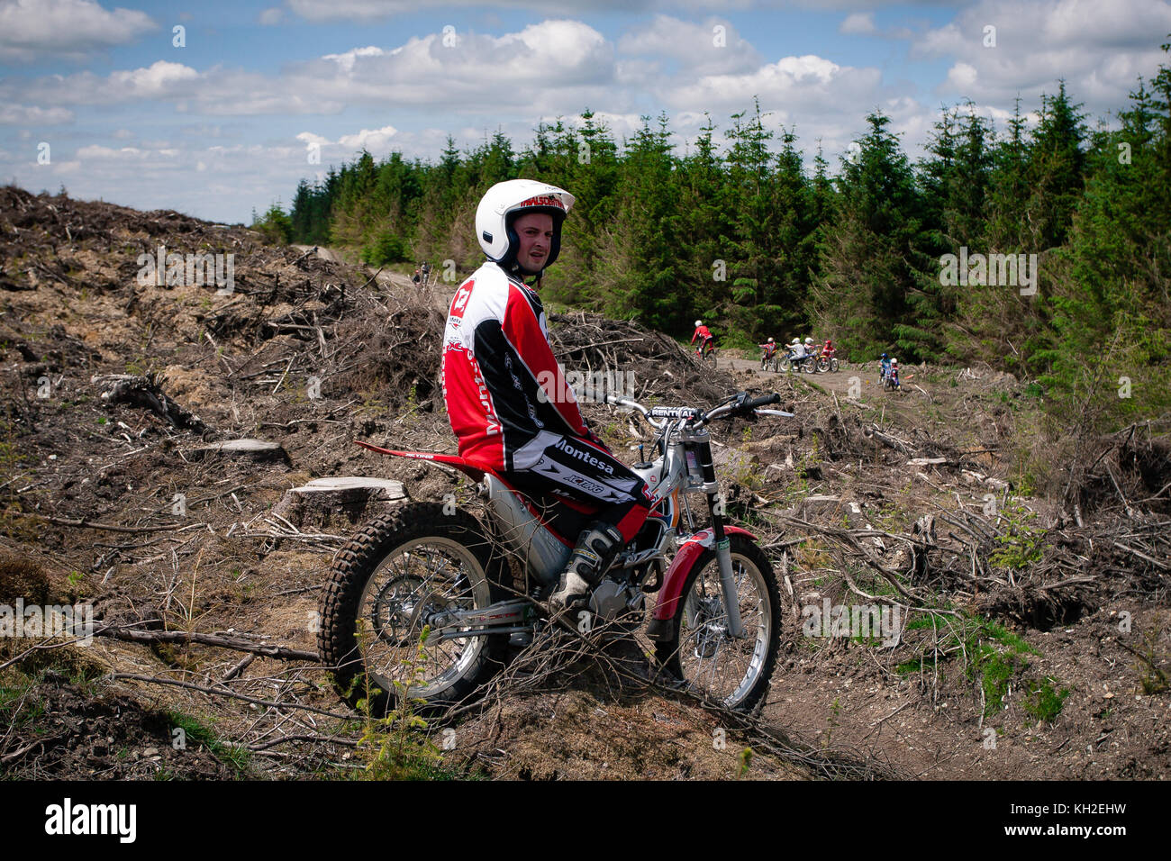 Motorcross bike rider resting after completing difficult part of a ...