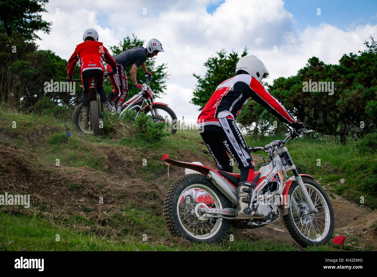 Motorcross riders on a motor cross trail racing through challenging ...