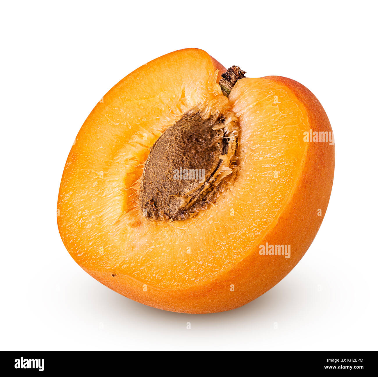 Fresh ripe apricot cut in half with bone isolated on white background ...