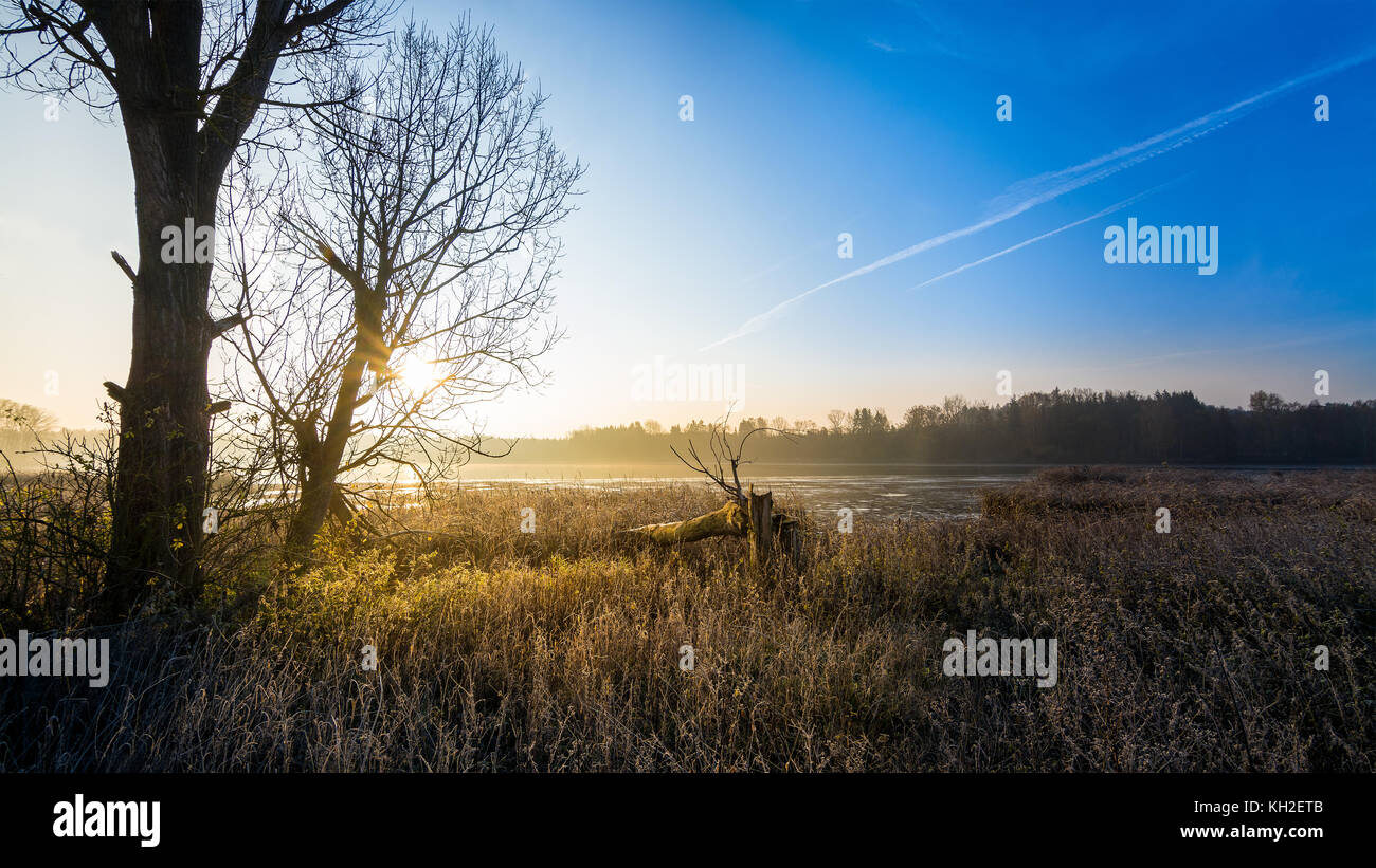 Idyllic morning landscape with a rising sun as background. Sunrise over ...