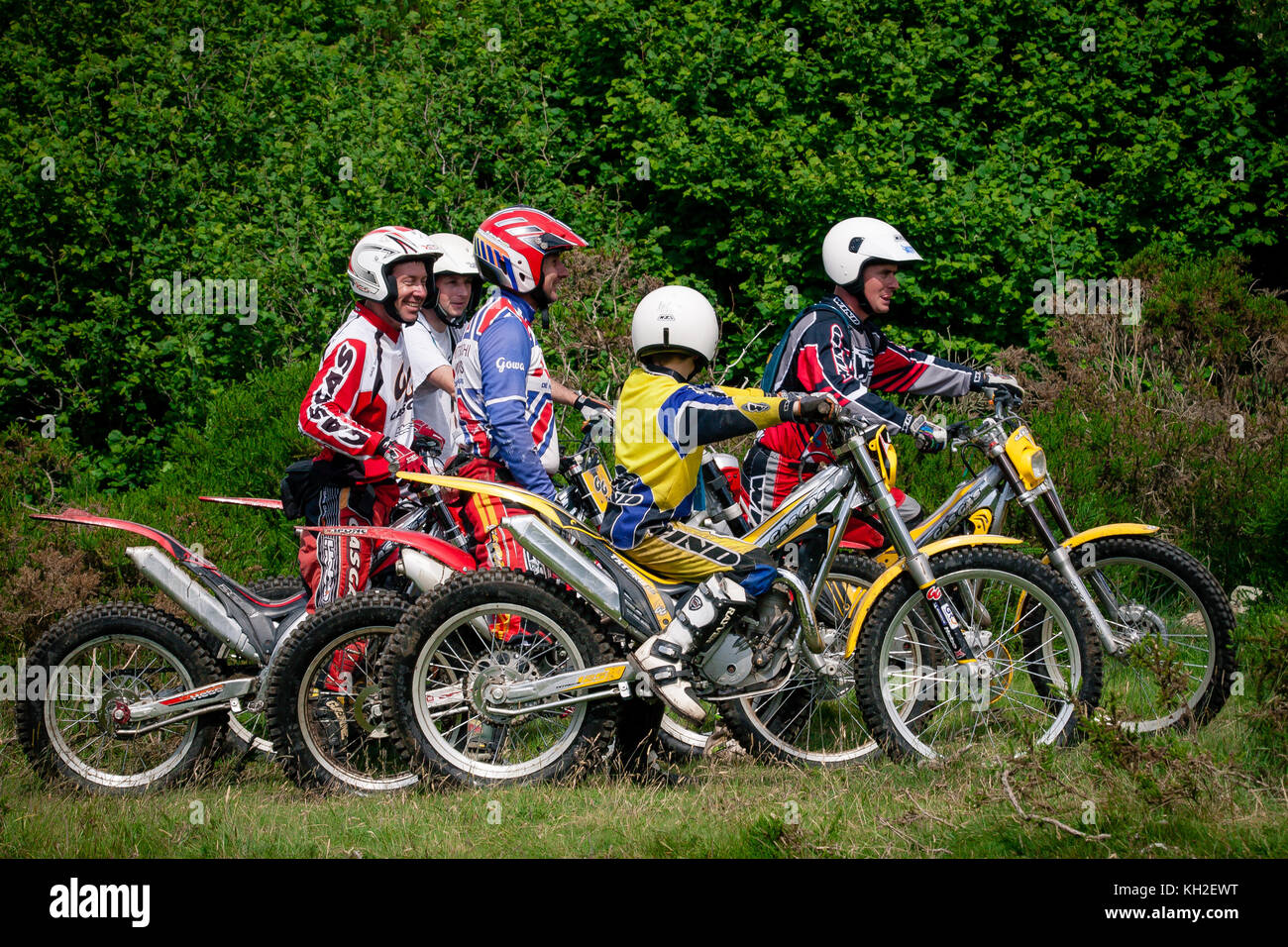 Group of motor cross bike riders waiting for their turn to start a ...