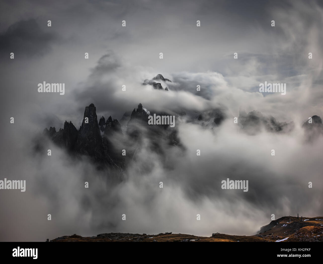 Dolomite mountain peaks in the fog hi-res stock photography and images ...