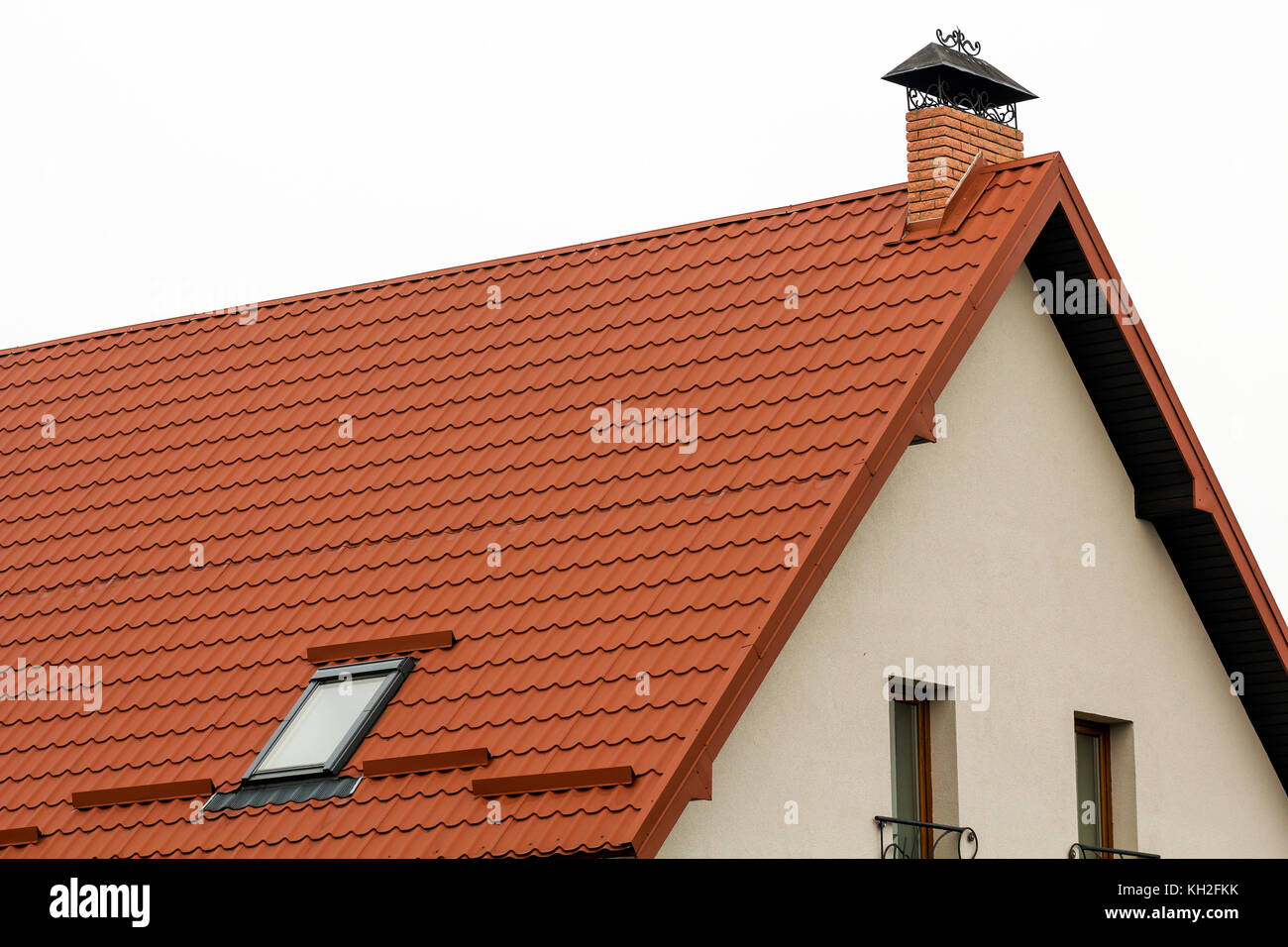 Roof of a new house made from yellow roofing tiles Stock Photo - Alamy