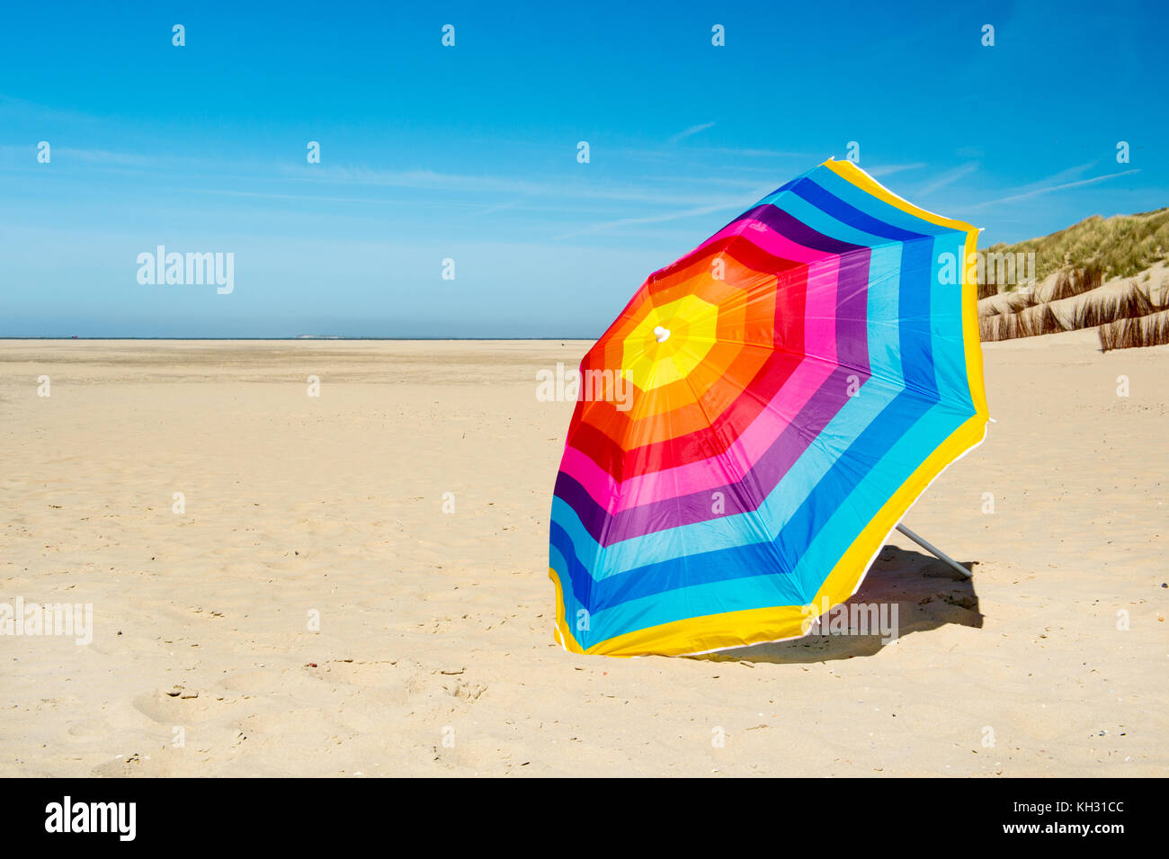 Colorful parasol at the summer beach Stock Photo - Alamy